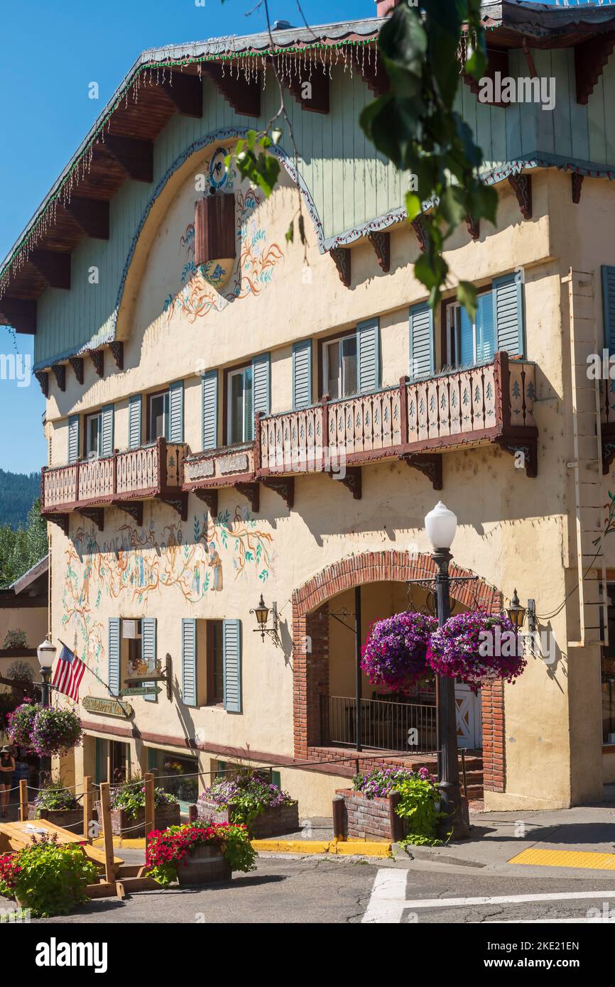 An ornately painted Bavarian style building with colorful flower ...