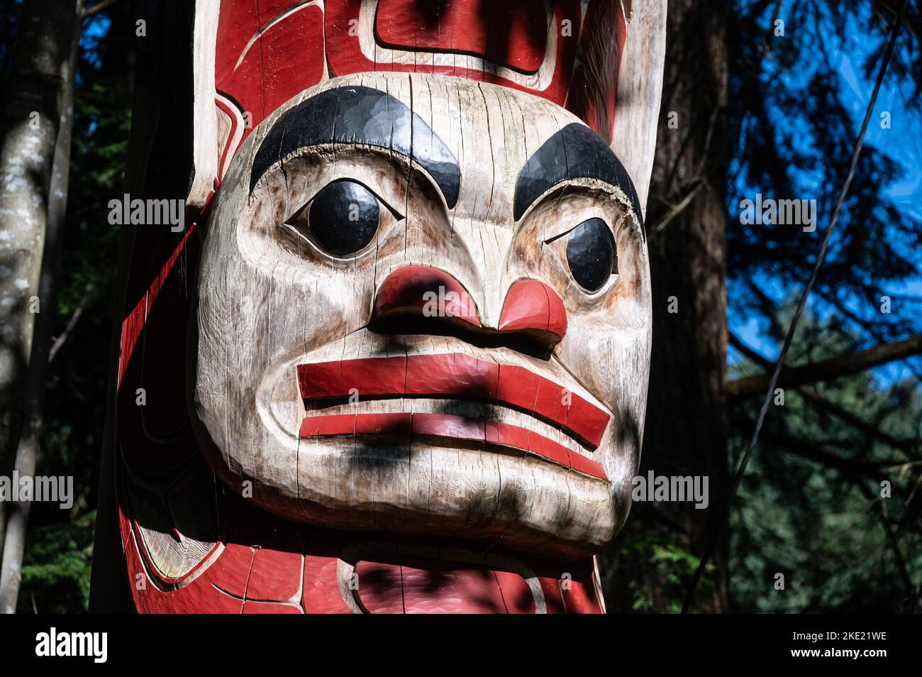 A closeup of colorful totem face in Totem Bight State Historical Park ...