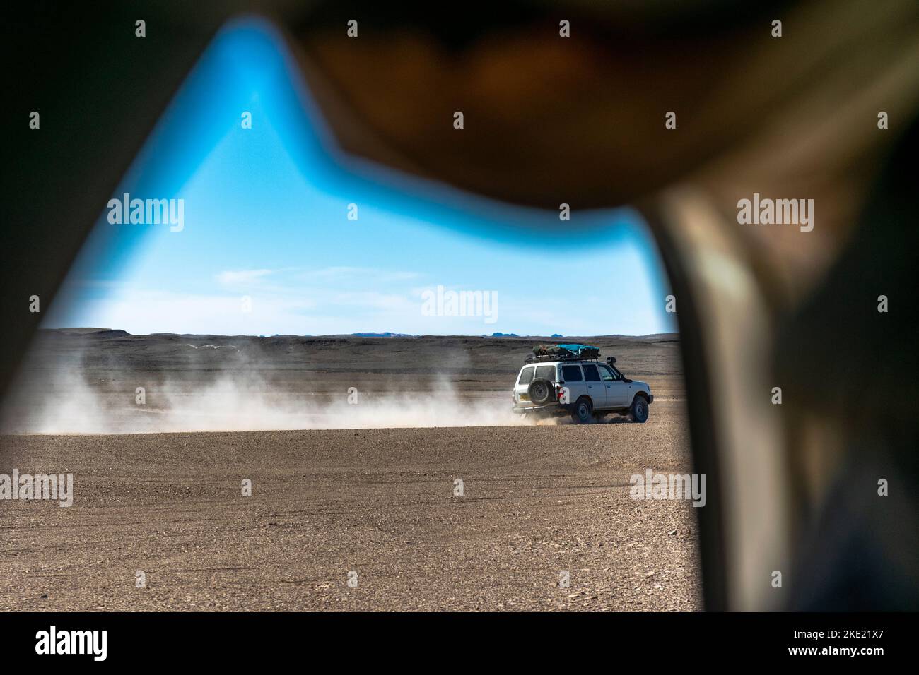 Window passenger view of a racing off-road 4x4 vehicle speeding in the ...