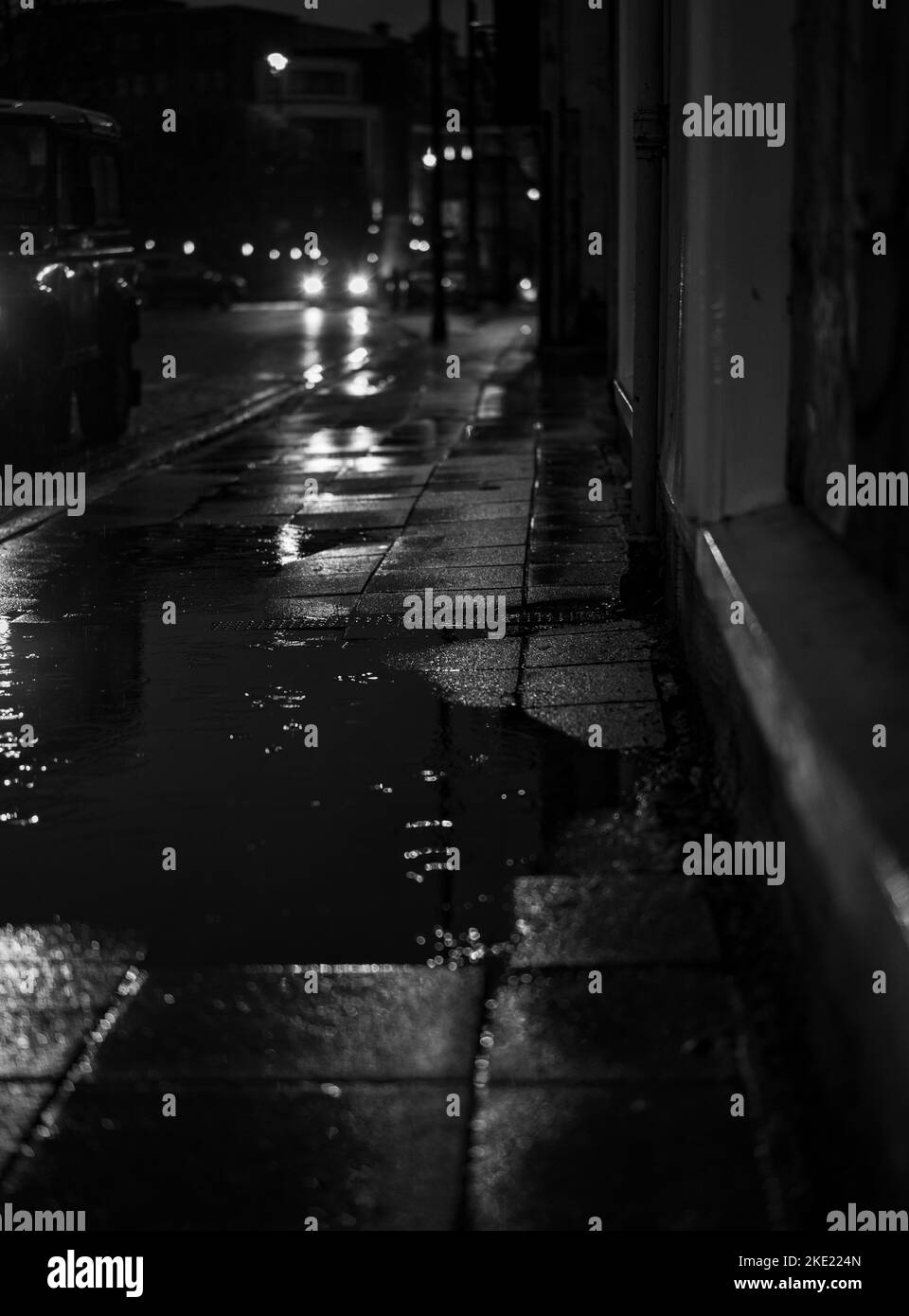 A wet ground near building in street Stock Photo - Alamy