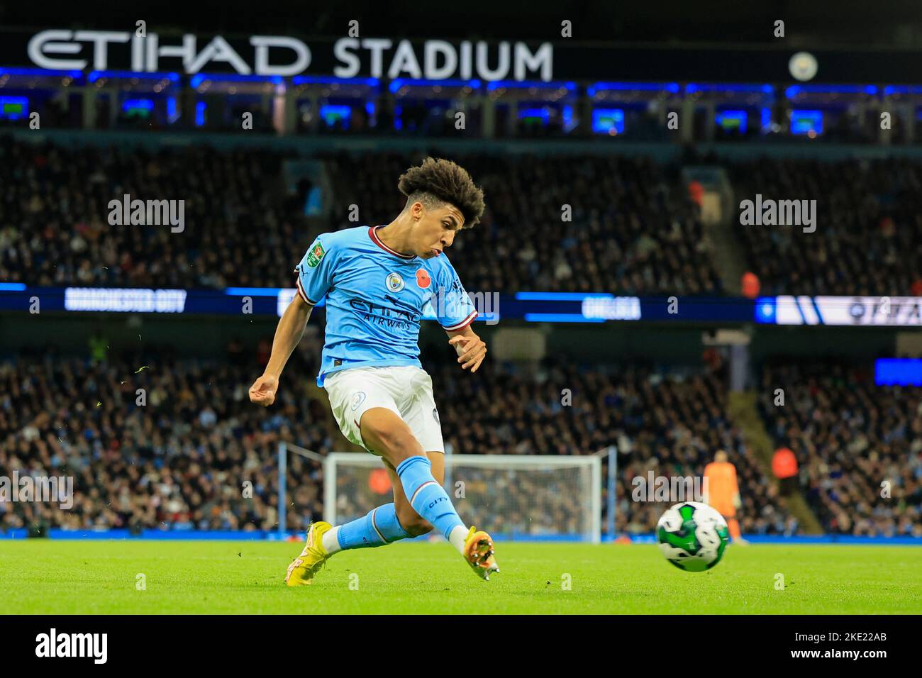 Rico Lewis #82 of Manchester City has a shot on goal during the Carabao ...