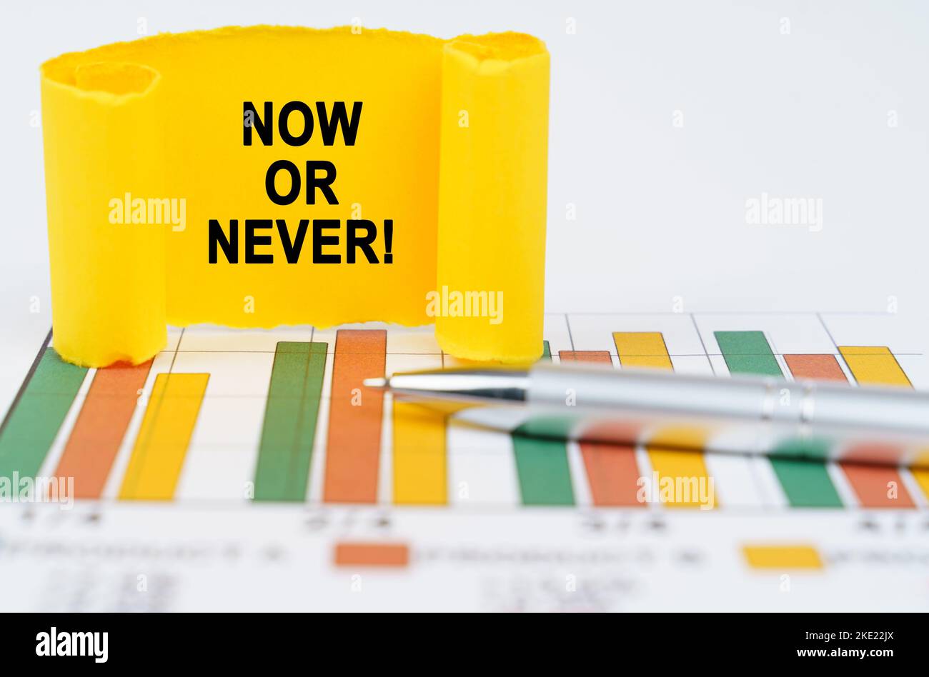 Business concept. On the business charts are a pen and a paper plate ...