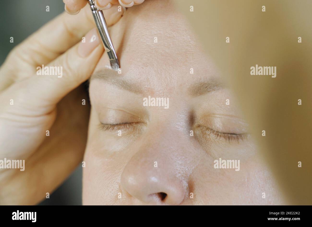 Coloring with white lines the design of the shape of the eyebrows on ...