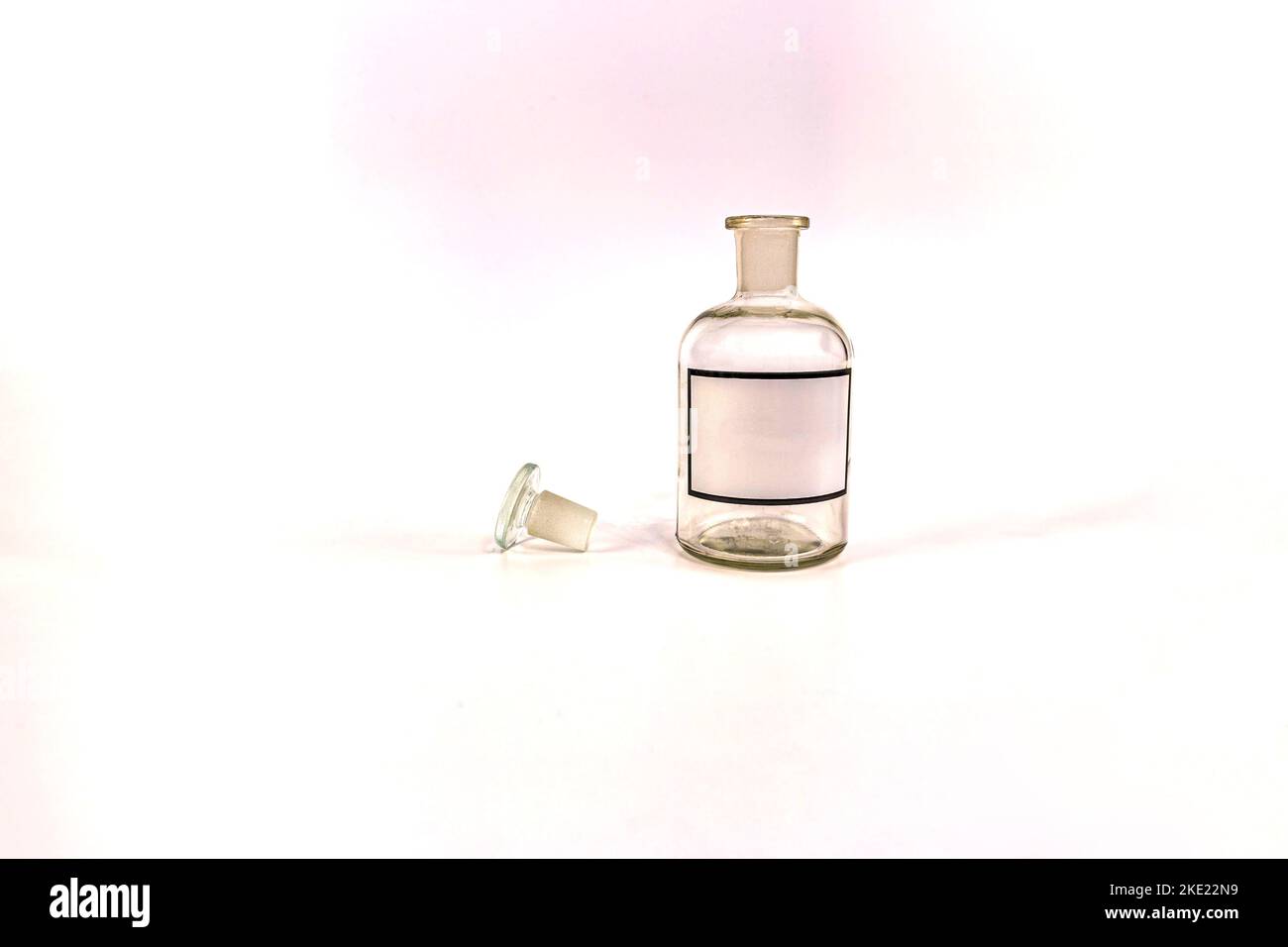 Transparent medical jar with a glass stopper on a white background ...