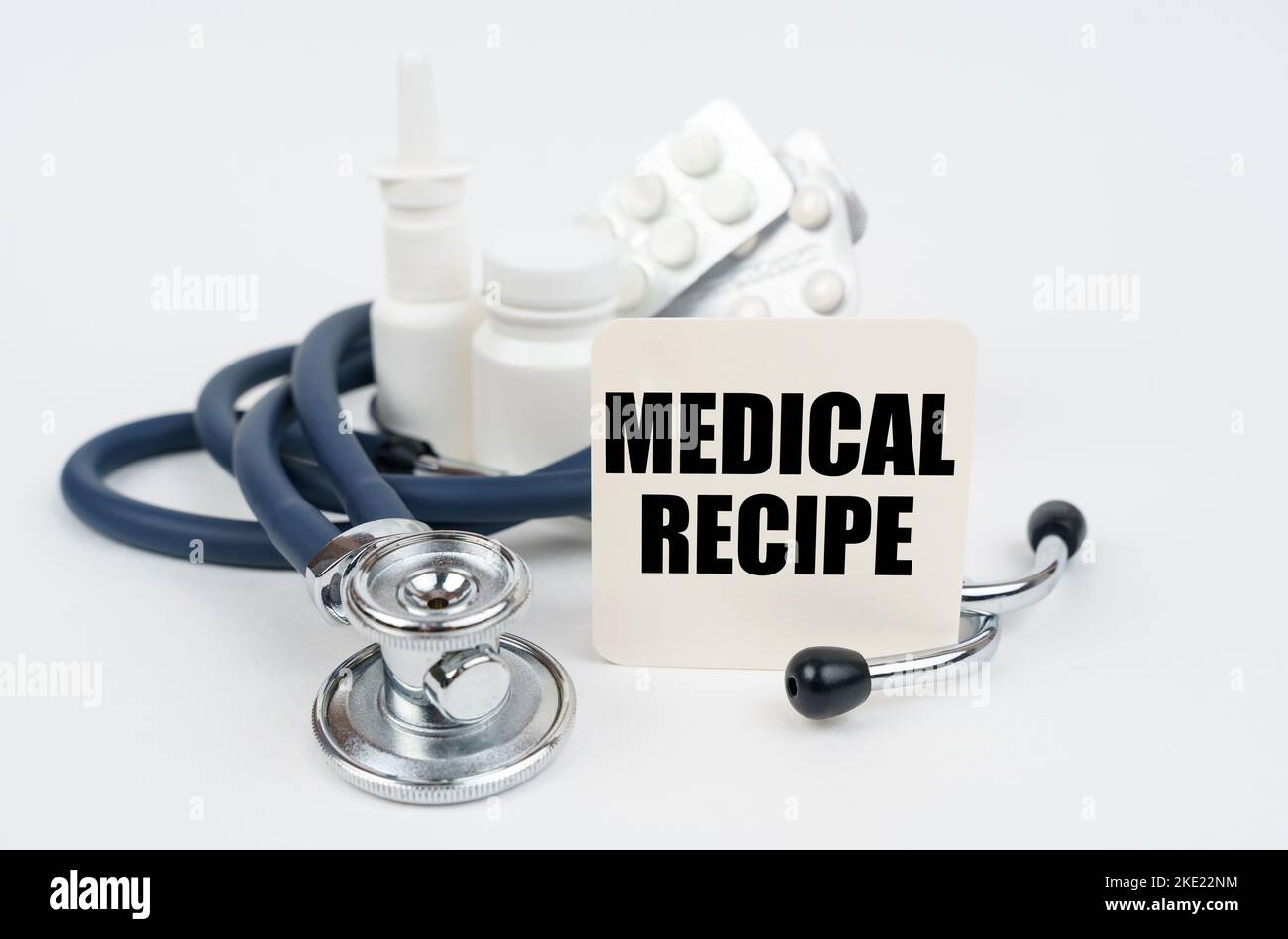 Medical concept. On a white surface, medicines, a stethoscope and ...