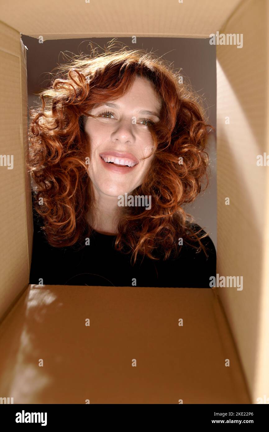 Happy woman receiving package hi-res stock photography and images - Alamy