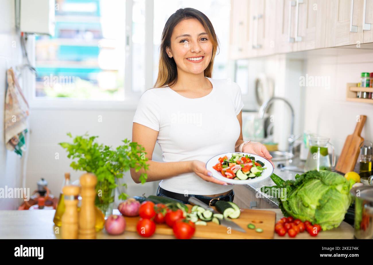 Colombian housewife before eating vegetable salad from plato Stock ...