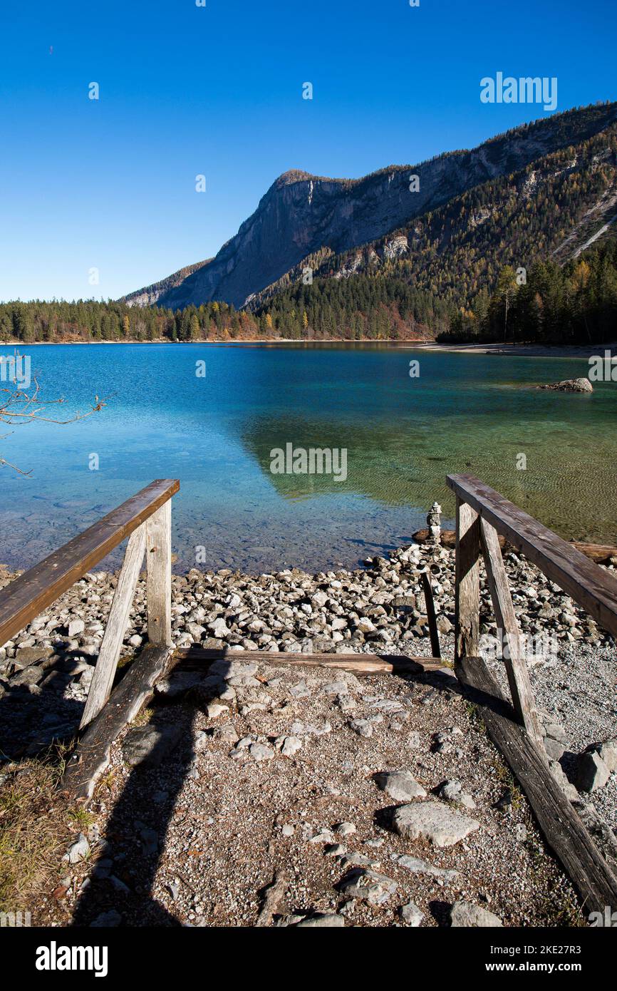 Wooden pier at Lake Tovel, Trentino Alto Adige, Italy. Vertical shot ...