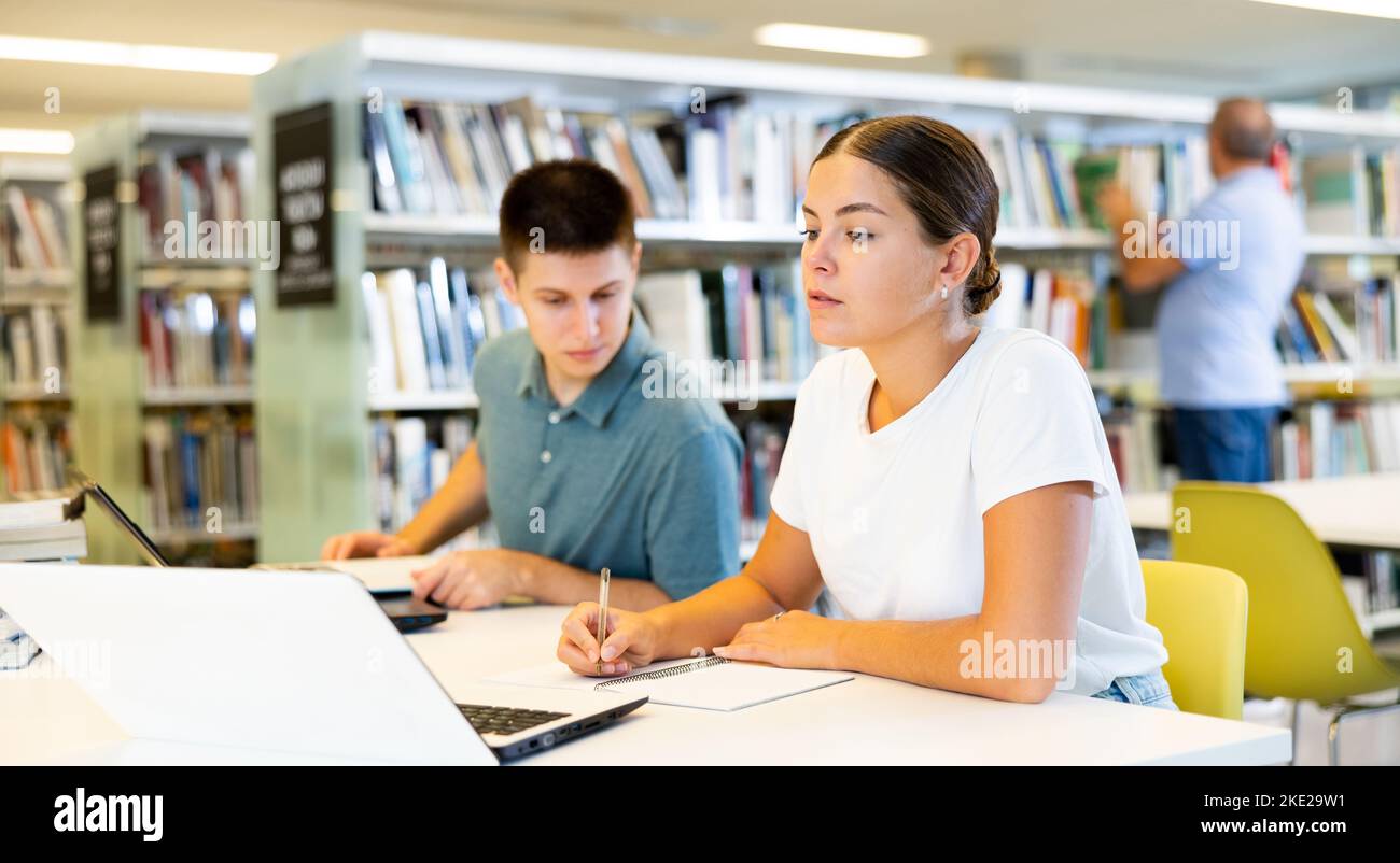 View on young european students studying together Stock Photo - Alamy