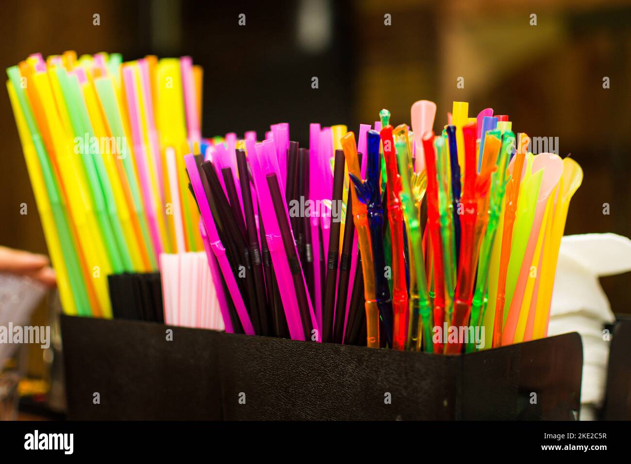 Bartender making refreshing coctail on a bar background. Dark moody ...