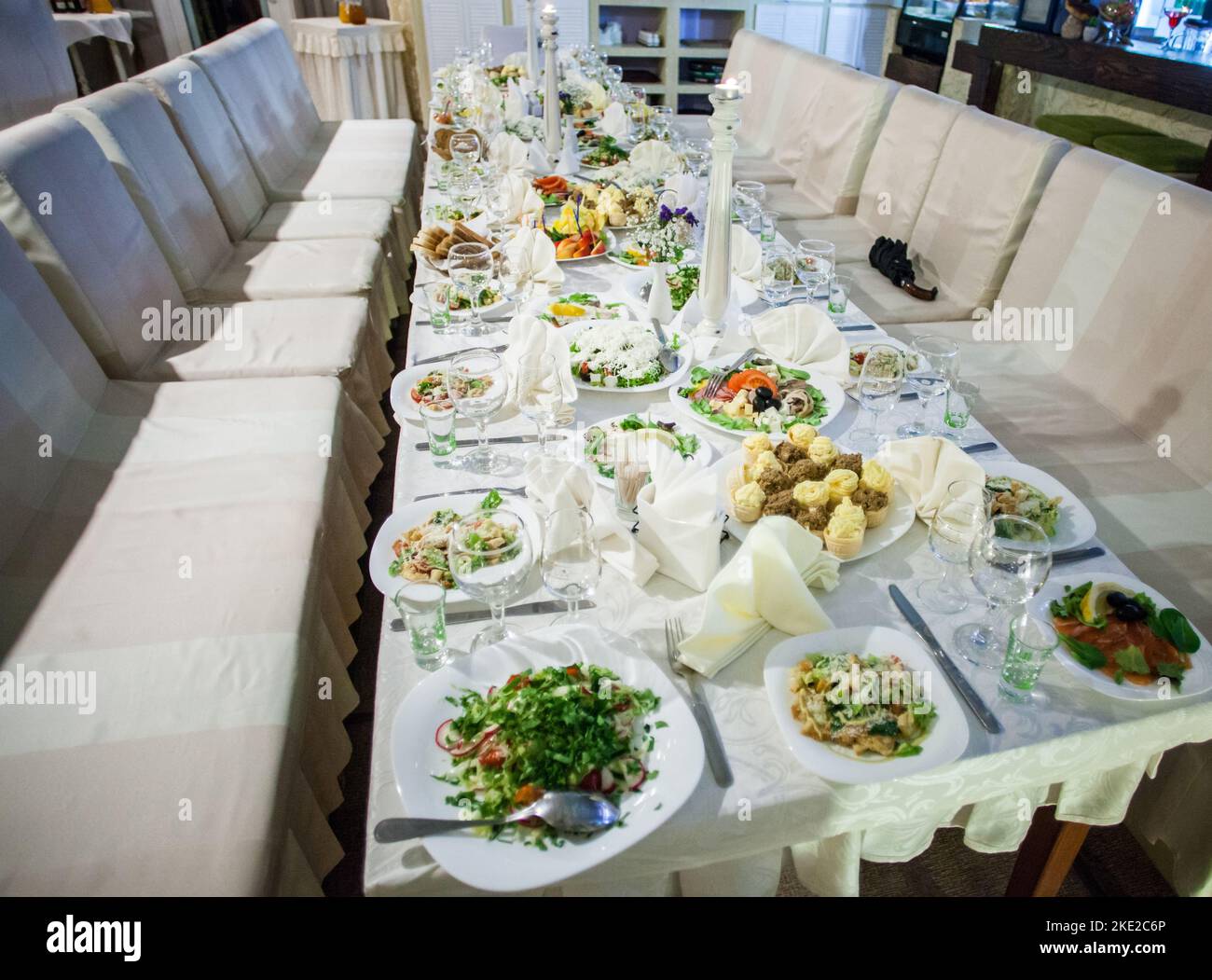 Decorated plate with fork and spoon. Table set up in boho style with ...