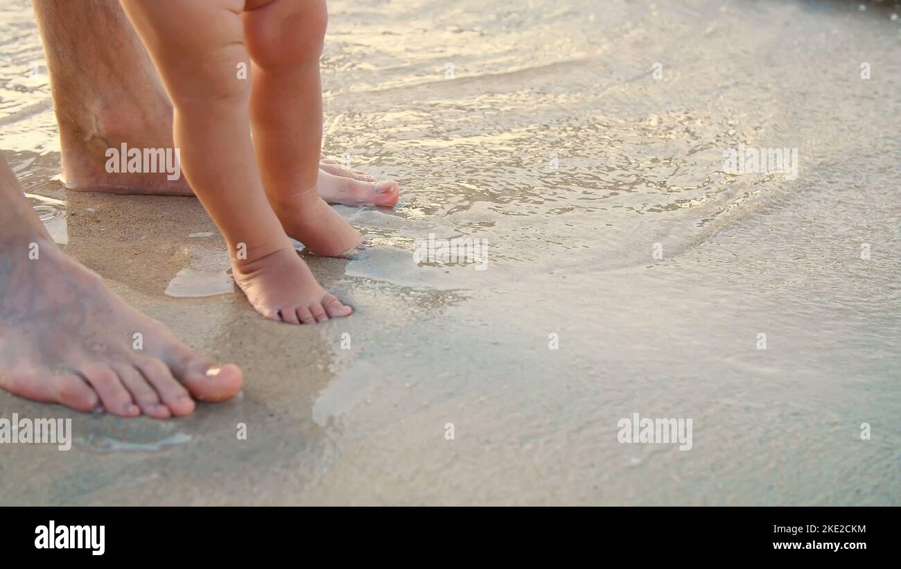 Wet female feet on the beach hi-res stock photography and images - Alamy