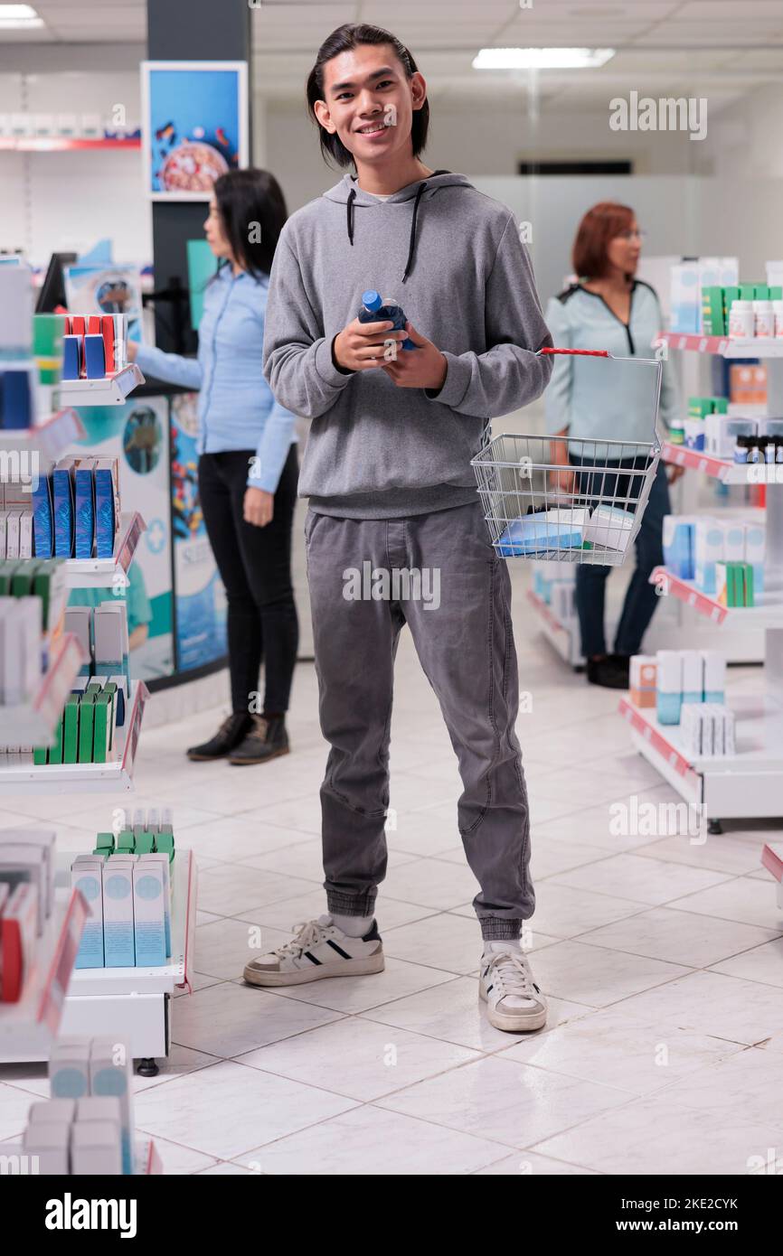 Male customer looking medicaments boxes hi-res stock photography and ...