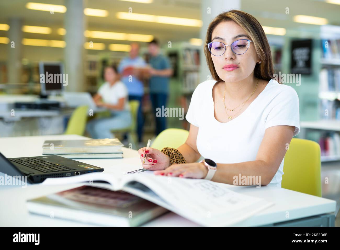 Mexican school student girl doing research on project Stock Photo - Alamy