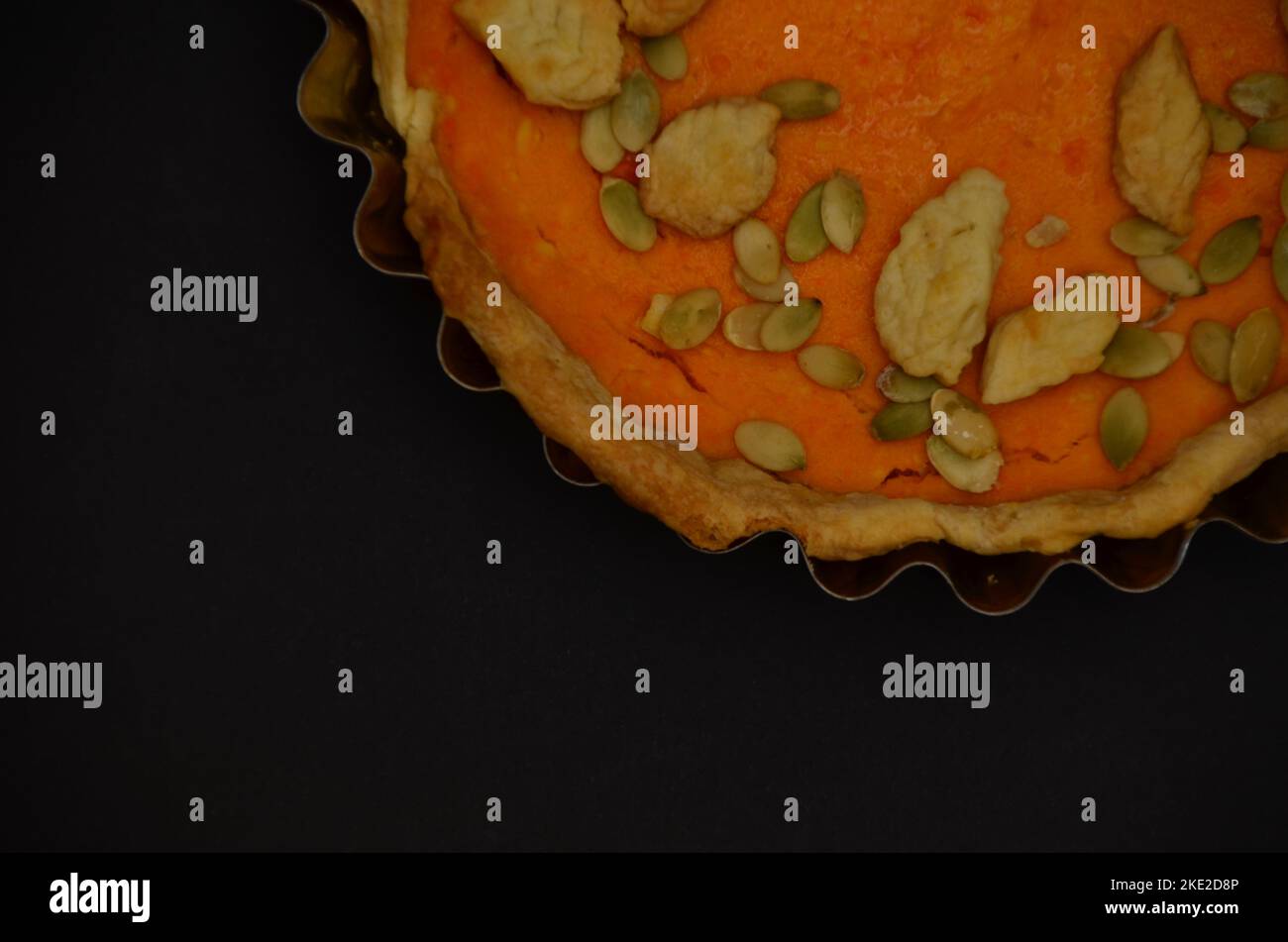 Fresh Homemade Pumpkin Pie made for Thanksgiving. on a black background ...