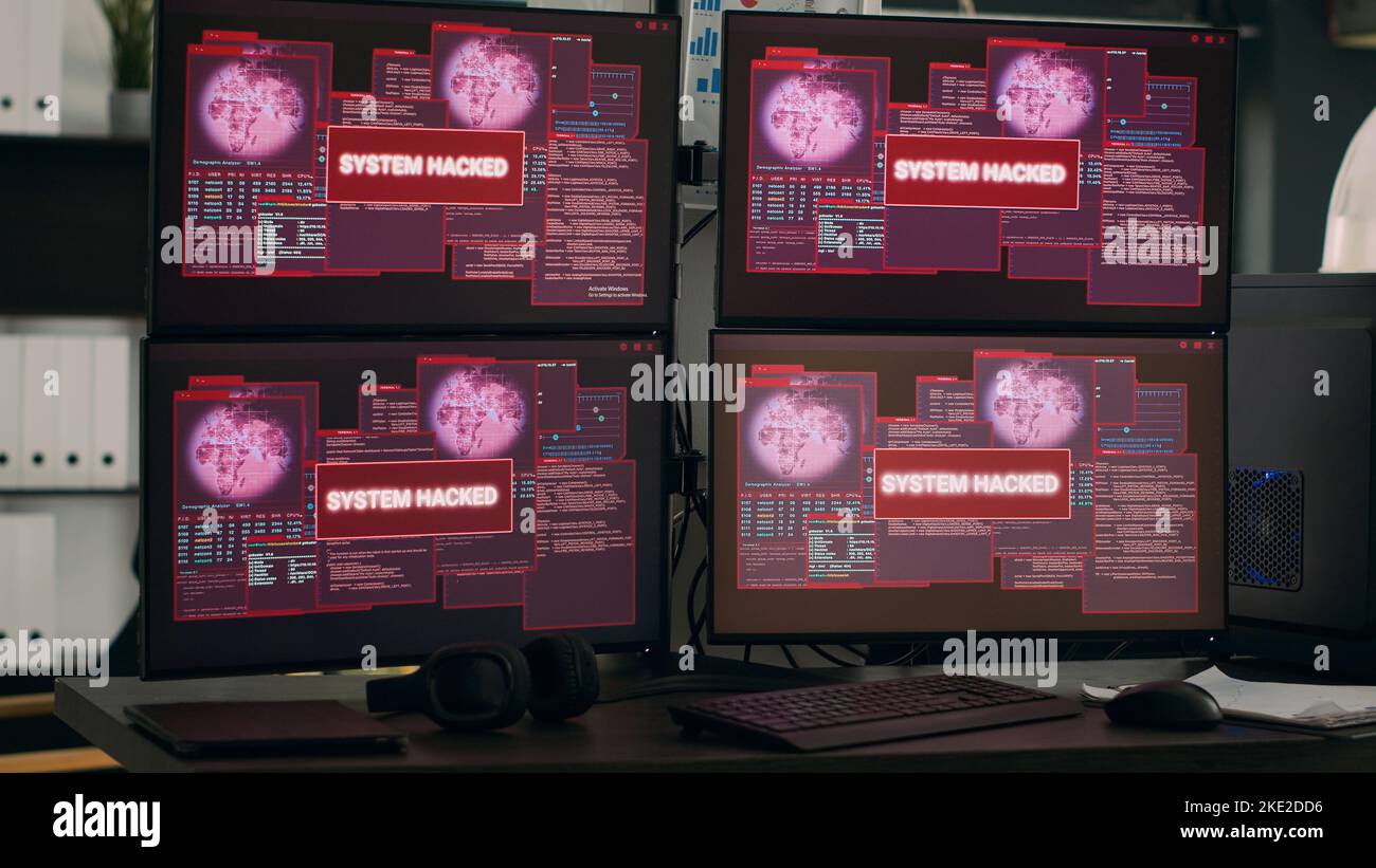 Multiple Monitors Displaying Hacking Warning Alert After Security