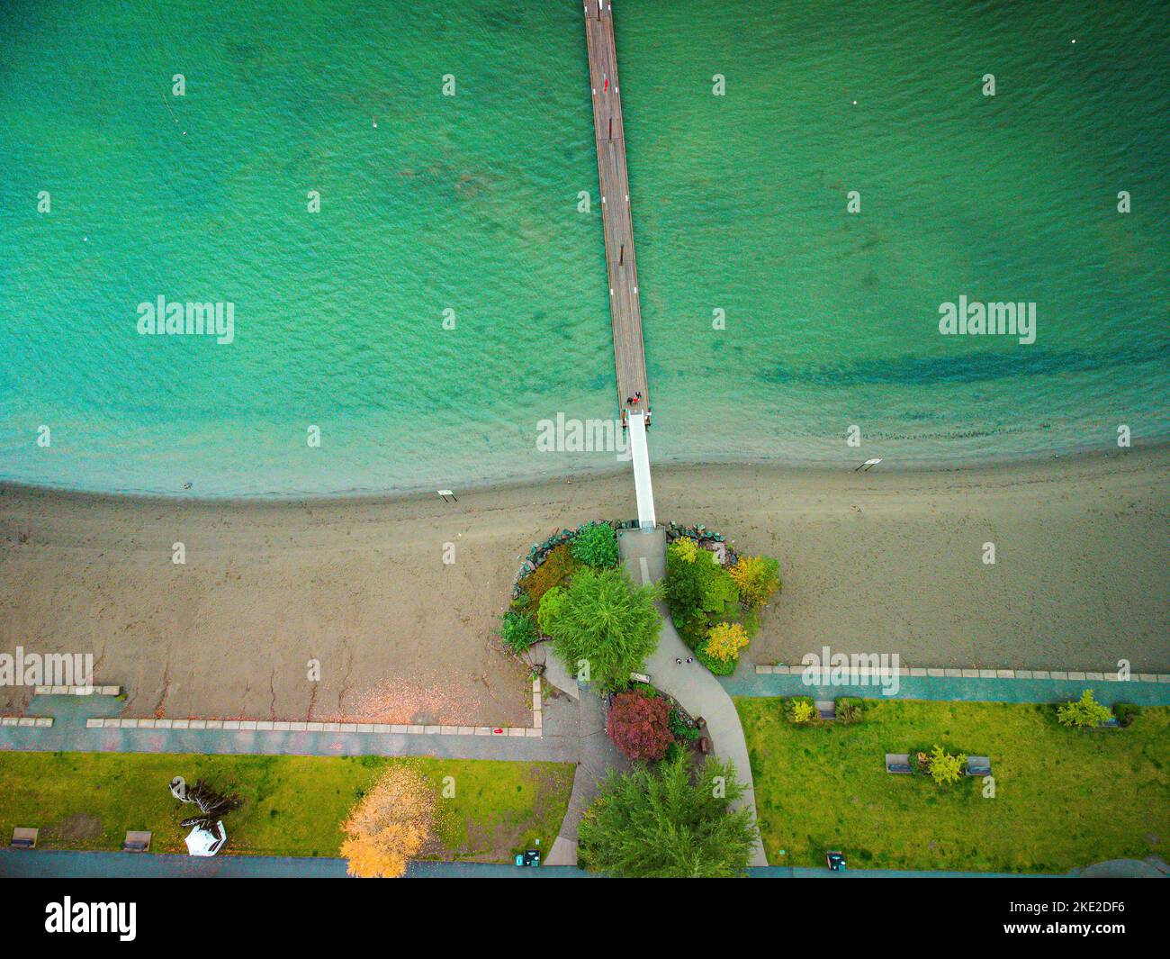 Drone photo of a bird's eye view of beach, pier and turquoise water at ...