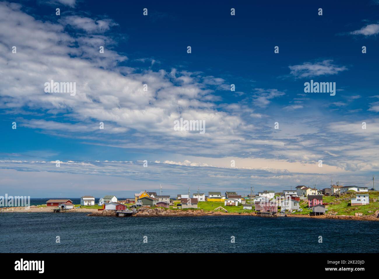 Village houses lining the harbour, Barr'd Islands, Newfoundland and ...