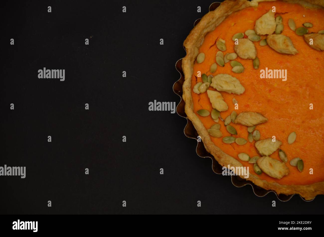 Fresh Homemade Pumpkin Pie made for Thanksgiving. on a black background ...
