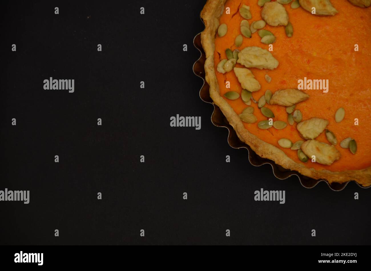 Fresh Homemade Pumpkin Pie made for Thanksgiving. on a black background ...