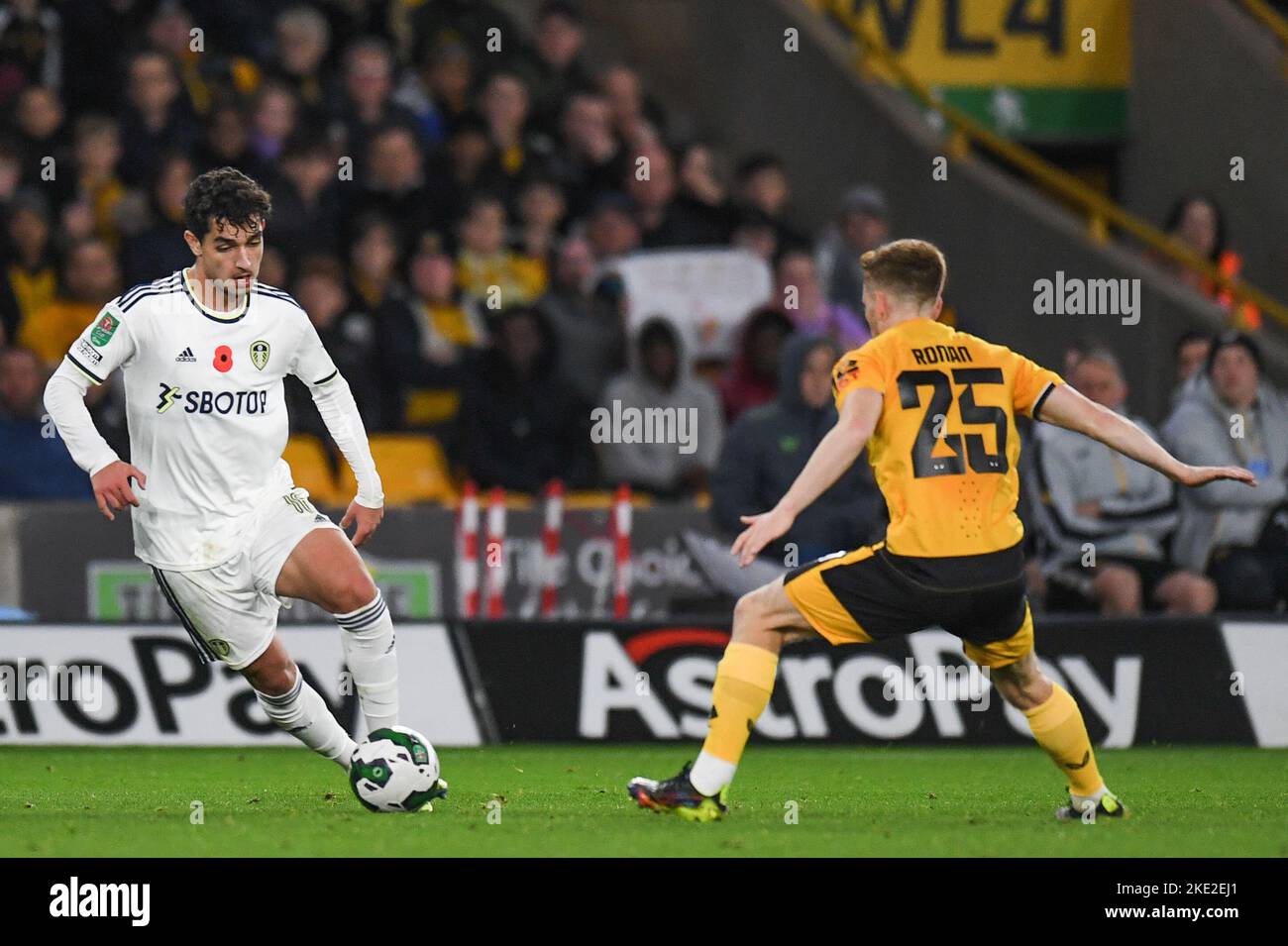 Sonny Perkins #16 of Leeds United takes on Connor Ronan #25 of ...