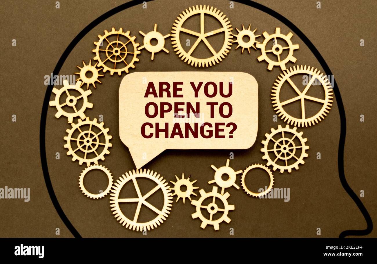 are you open to change. two notepads with text. near bright stationery ...