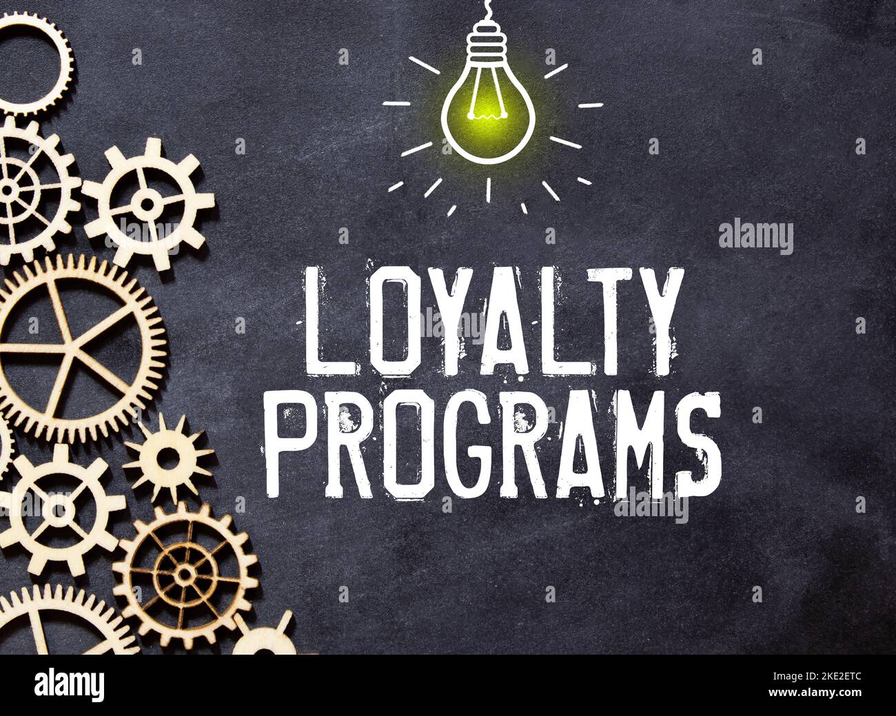 On a light-colored office table is a computer, a black calculator, a ...