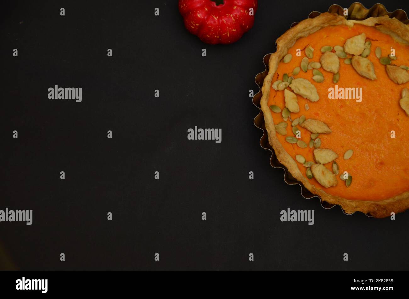 Fresh Homemade Pumpkin Pie made for Thanksgiving. on a black background ...