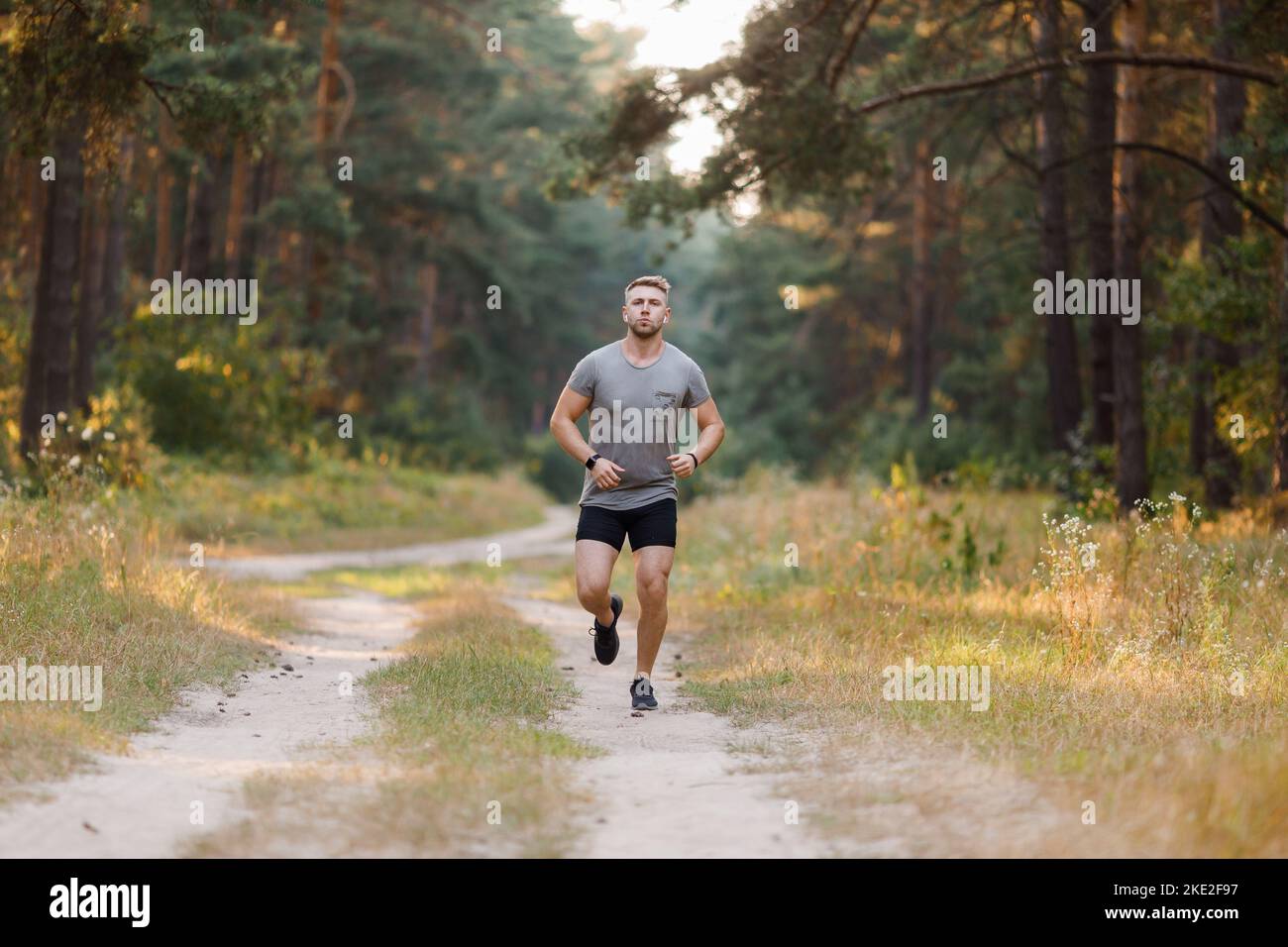 Muscular man running outdoors Stock Photo - Alamy