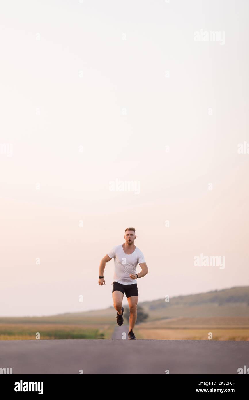Jogging on road hi-res stock photography and images - Alamy