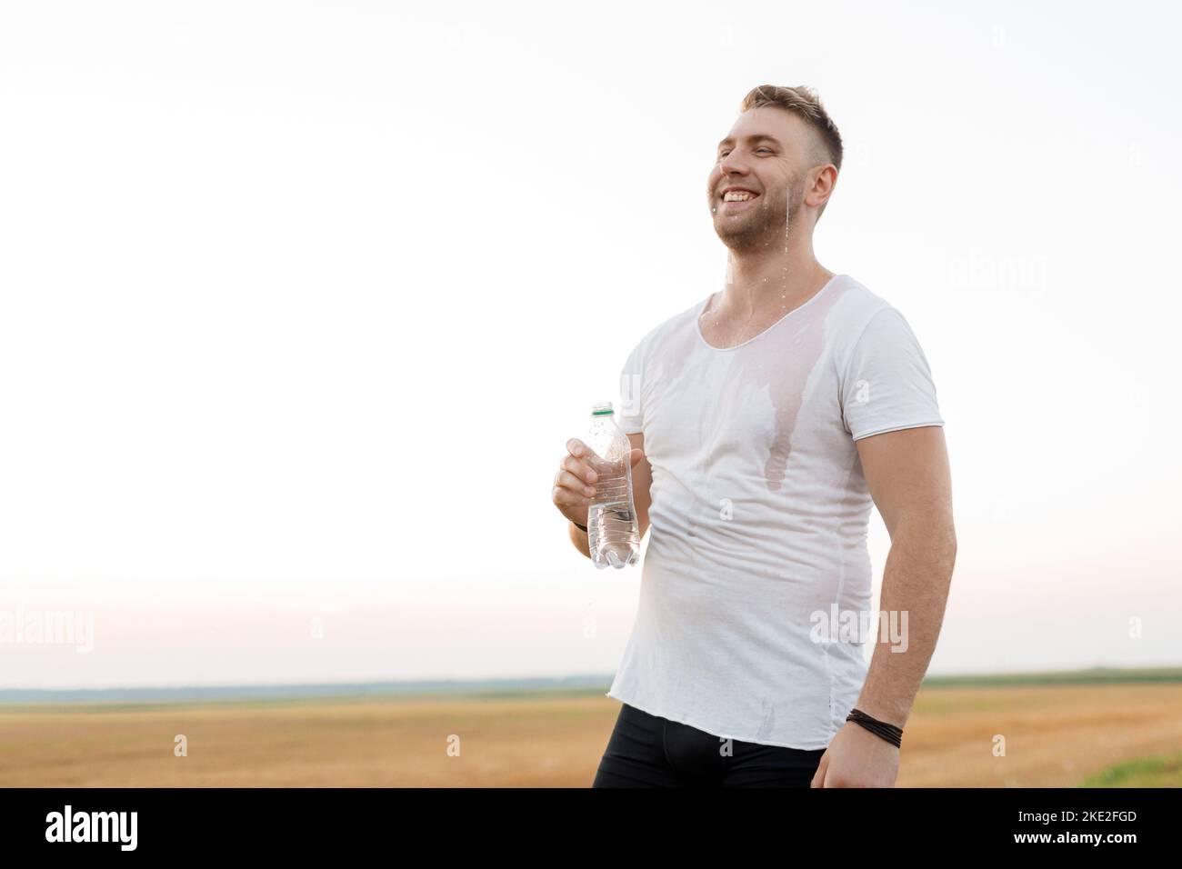 Man drinking water after run Stock Photo - Alamy