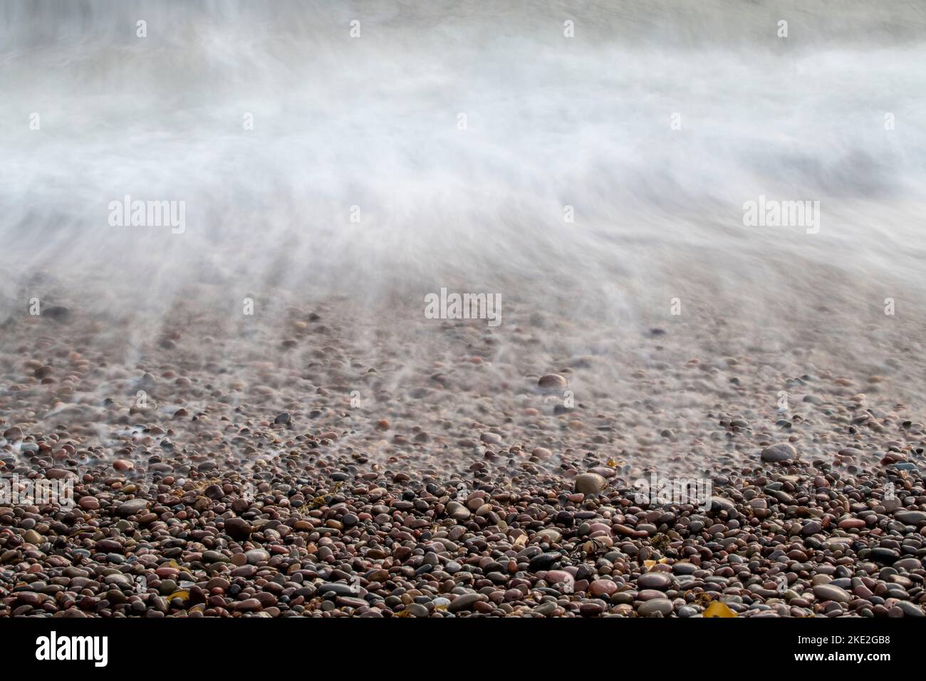 Beach pebbles in the surf, Mainland, Newfoundland and Labrador NL ...