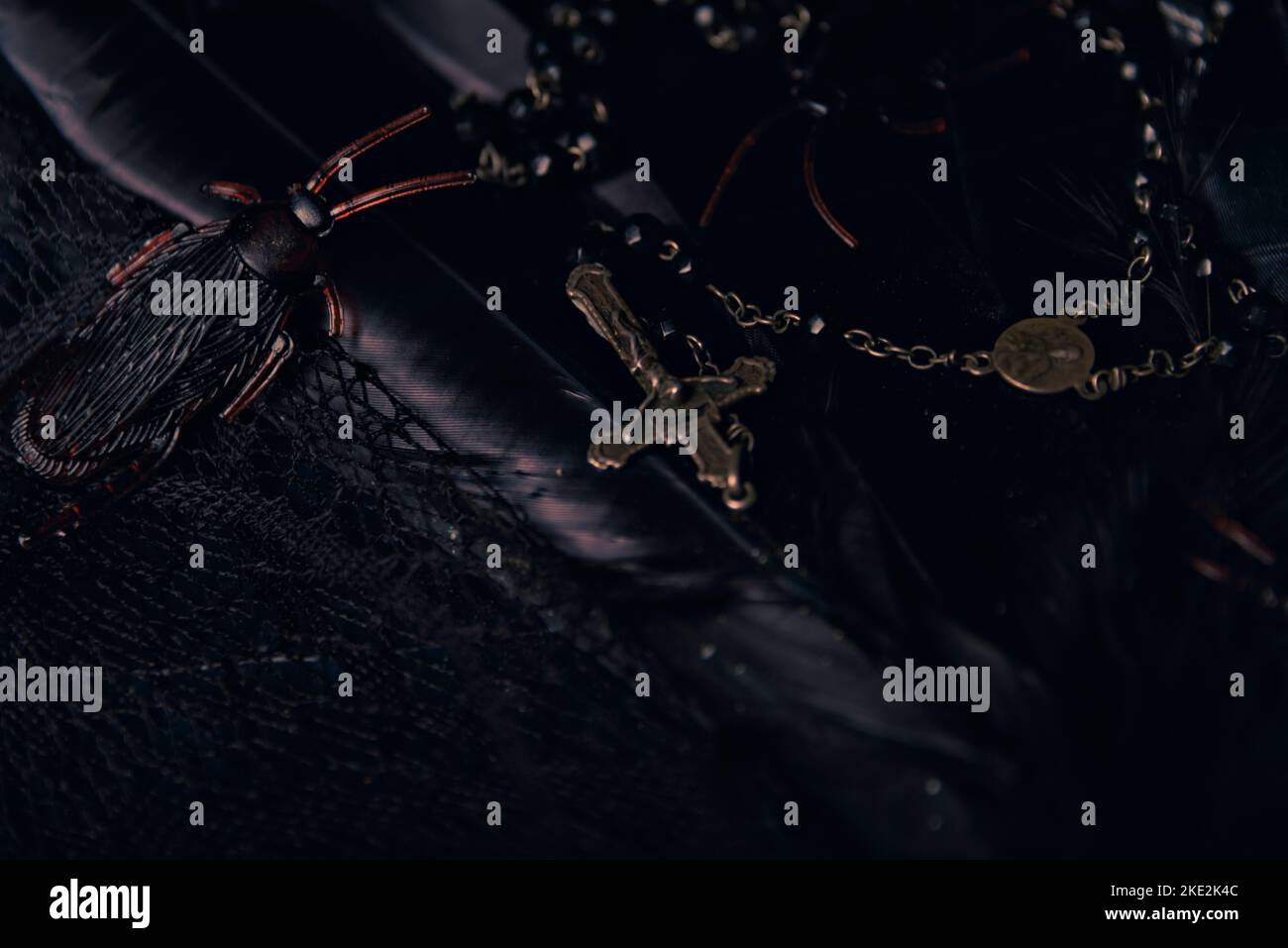 Witchcraft composition with burning candles, books, jewelry and ...