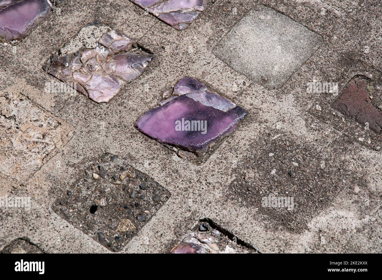 Purple bricks in path with various shades of purple against the ...