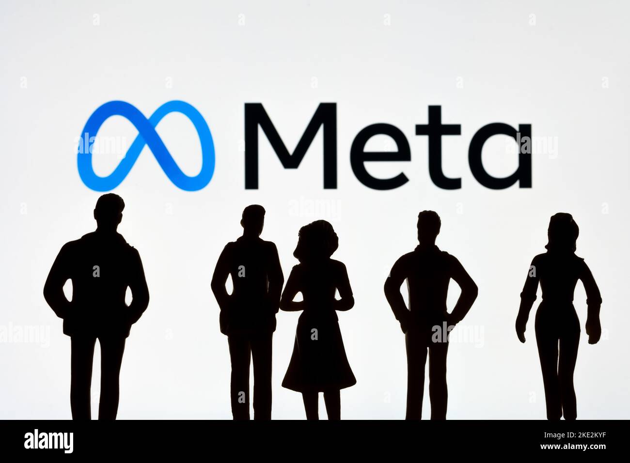 silhouette of mini figurines of people and Meta company logo. Concept ...