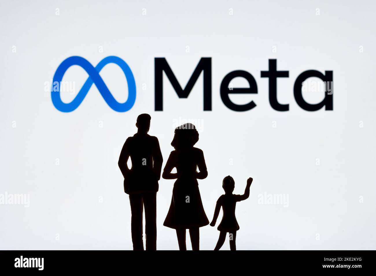 silhouette of mini figurines of family and Meta company logo. Concept ...