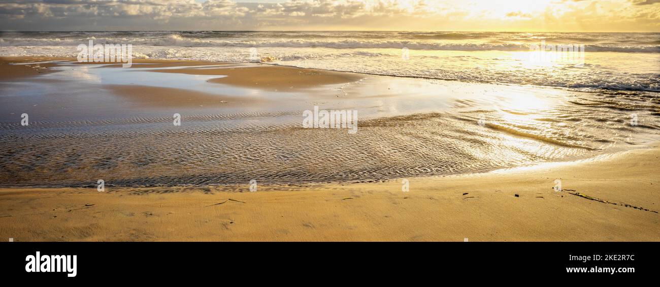 Sunrise panorama over a sandy beach on the popular Sunshine Coast ...