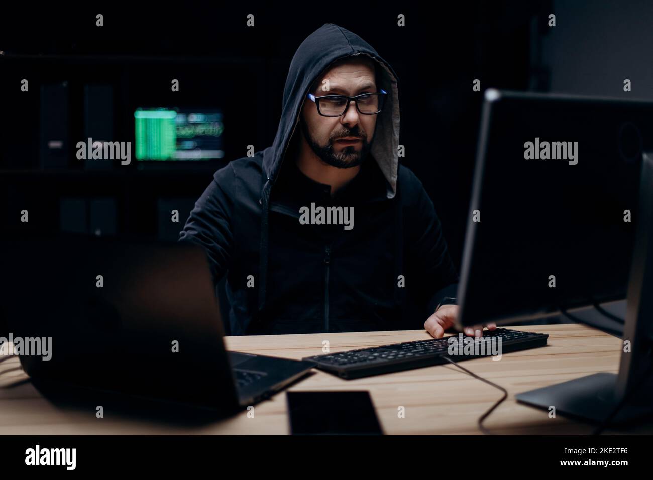Hacker working on computer Stock Photo - Alamy
