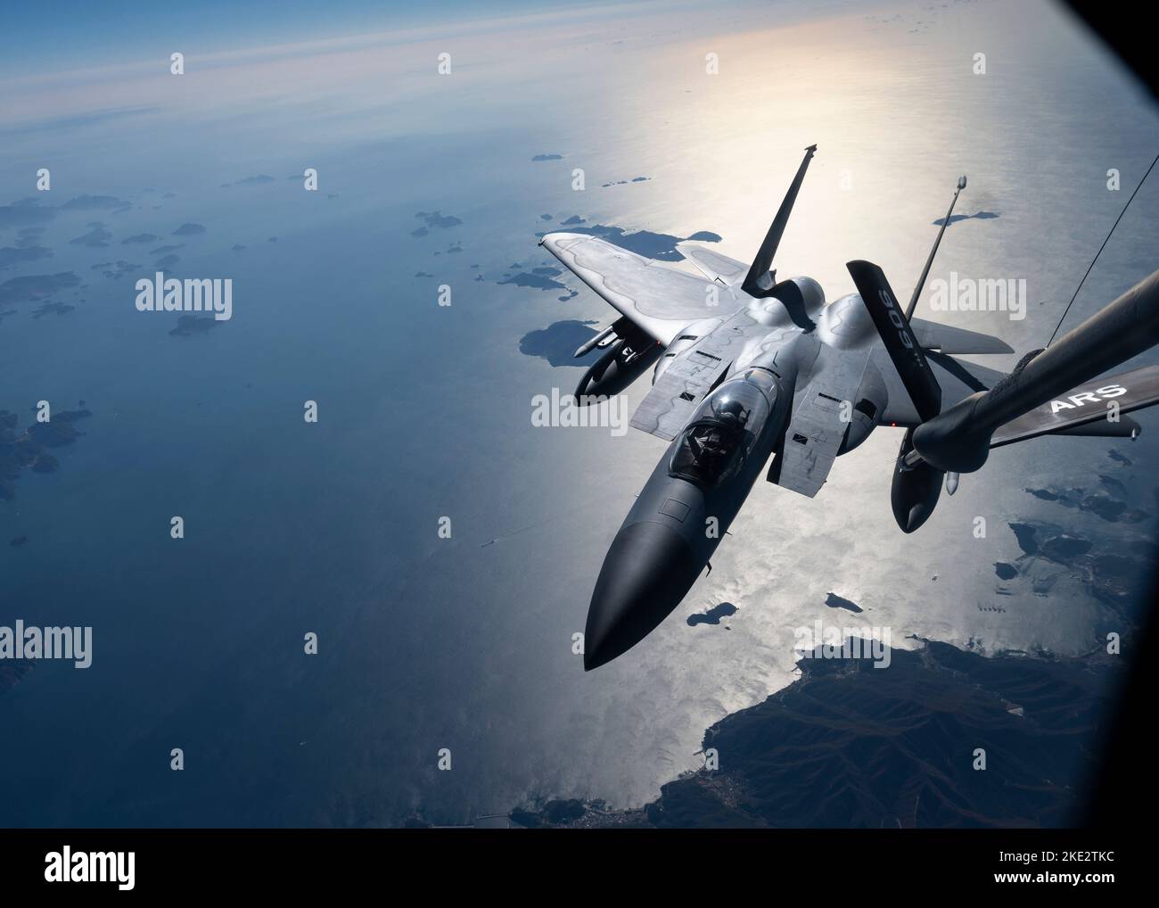 A U.S. Air Force 44th Fighter Squadron F-15C Eagle approaches a 909th ...