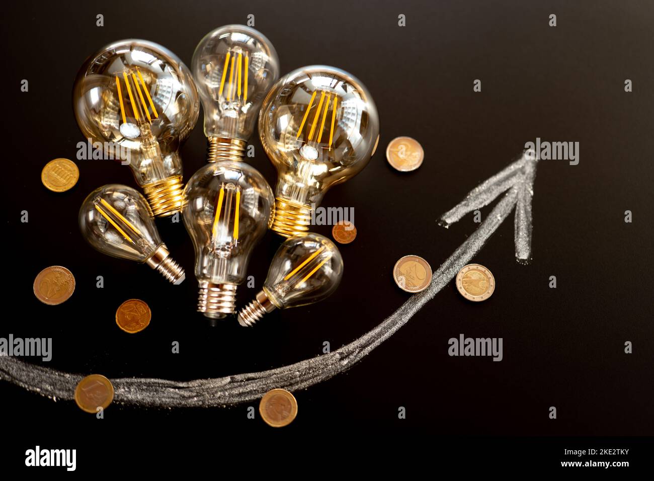 Electricity cost.Rising electricity prices.light bulbs energy saving ...