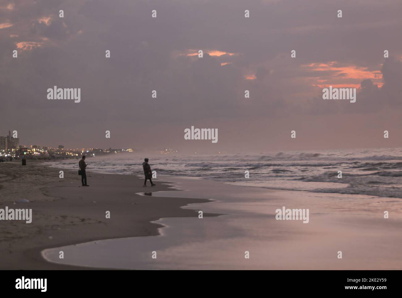 Palestinian refugees walk on the beach west of Gaza City. (Photo by ...