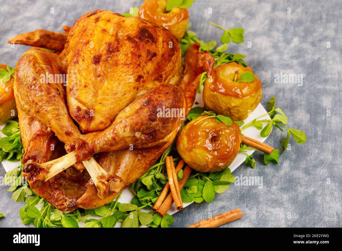 Roasted turkey garnished with apples and caramel sauce Stock Photo - Alamy