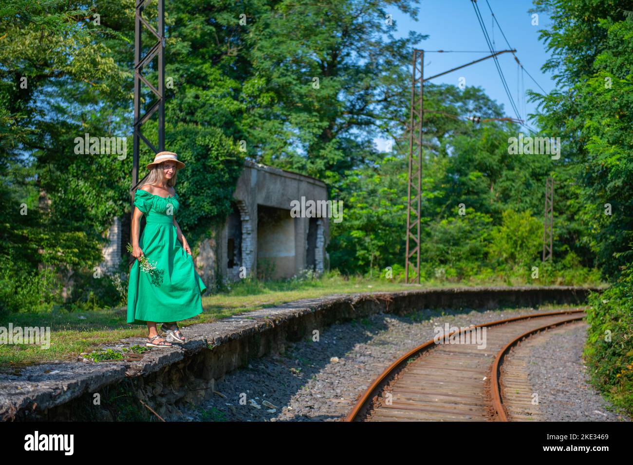 Woman walking on railway track hi-res stock photography and images - Alamy