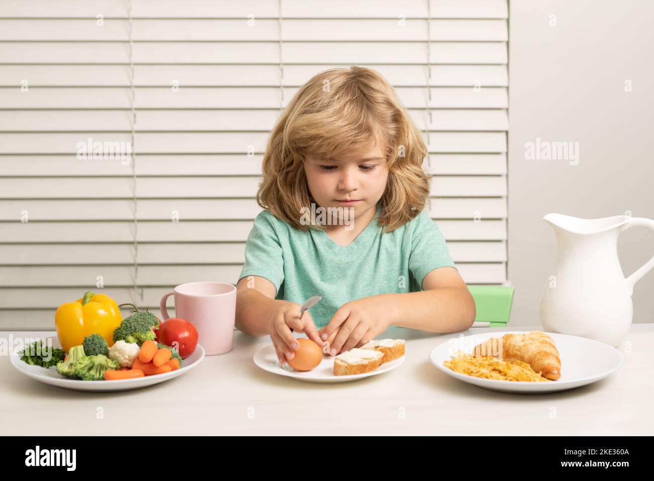 Little child boy having healthy breakfast. Kids nutrition and ...