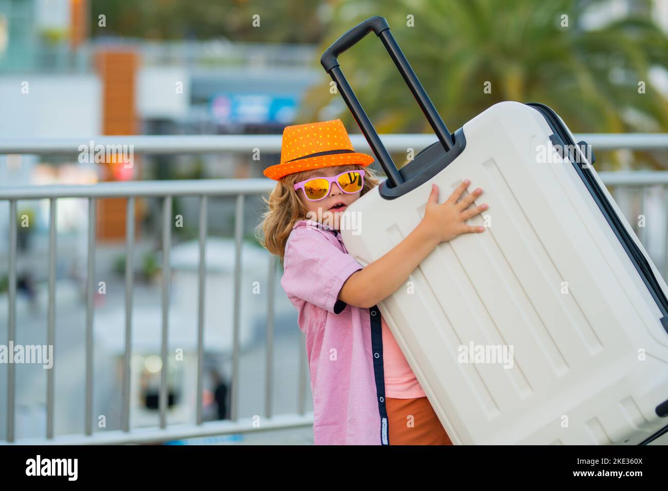 Child with suitcase going on vacation. Tourist boy on holiday, travel ...