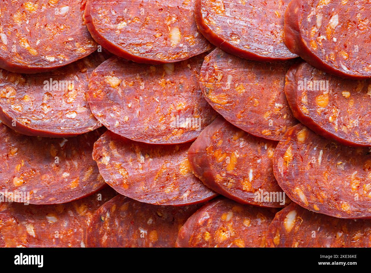 Salami spicy smoked sausage cut, full frame background Stock Photo - Alamy