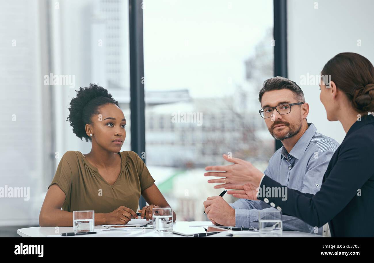 Making small opportunities grow big. a group of colleagues having a ...