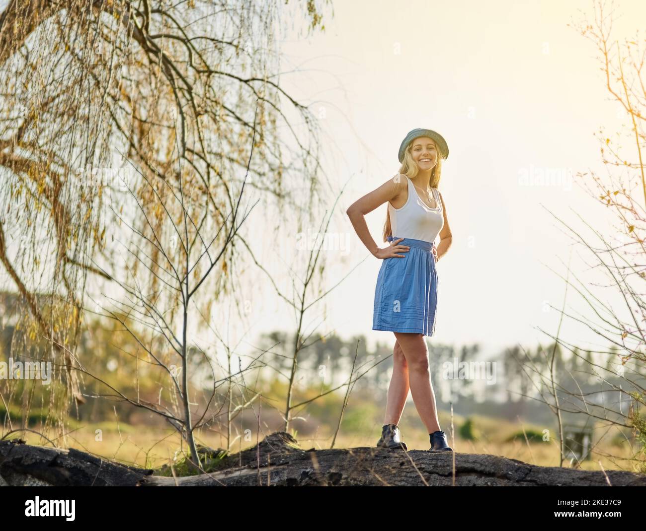 Make it a habit to spend more time in nature. a young woman on a tree ...