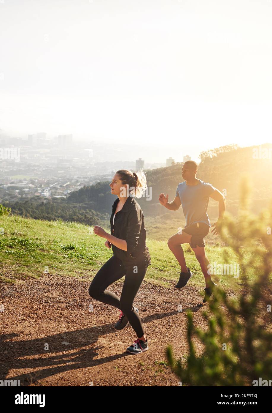 Yeah I run like a girl, try to keep up. a sporty couple out running on ...
