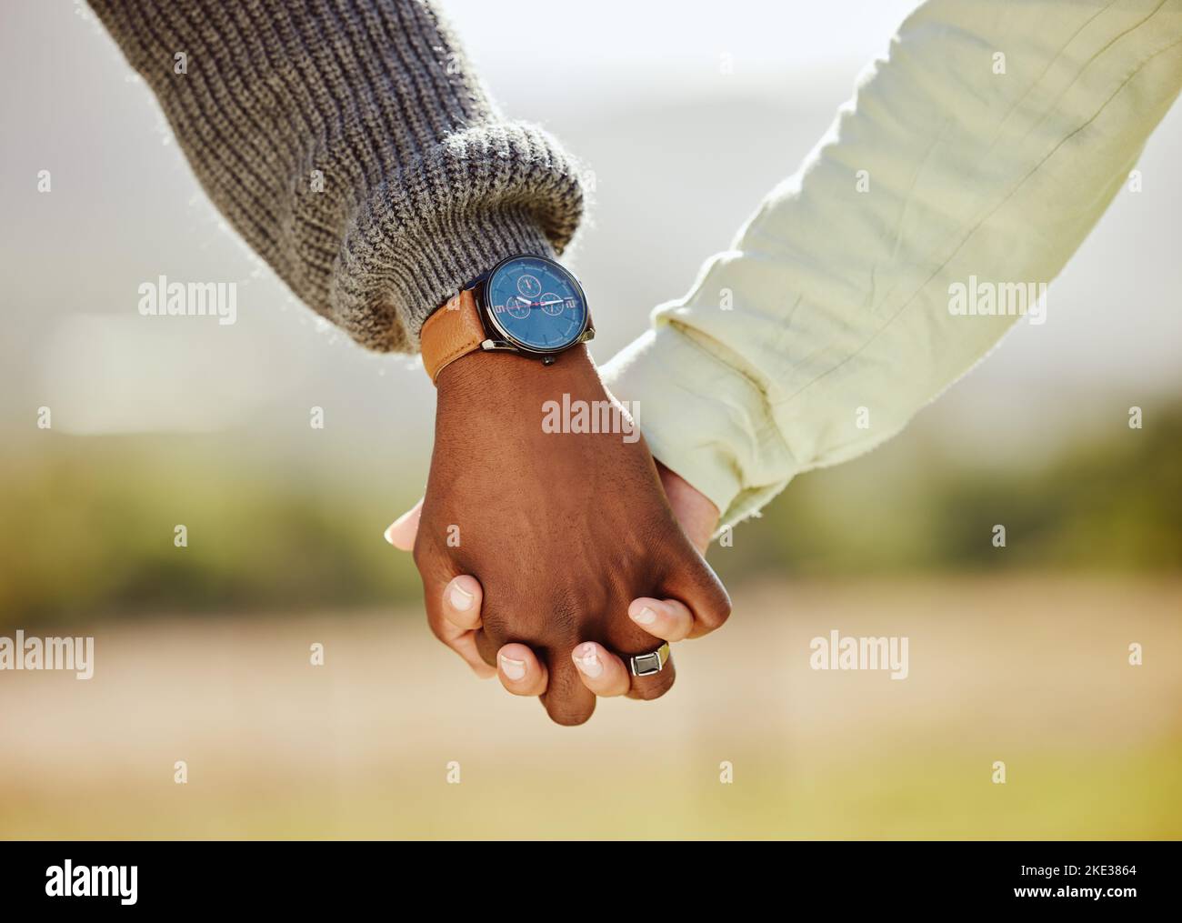 Love, trust and couple holding hands in nature for spring, support and ...